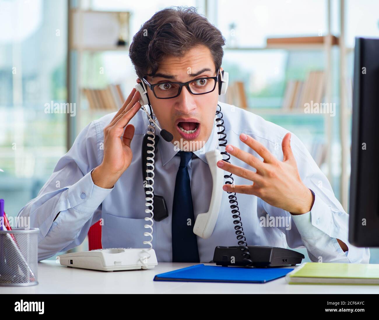 The unhappy angry call center worker frustrated with workload Stock ...