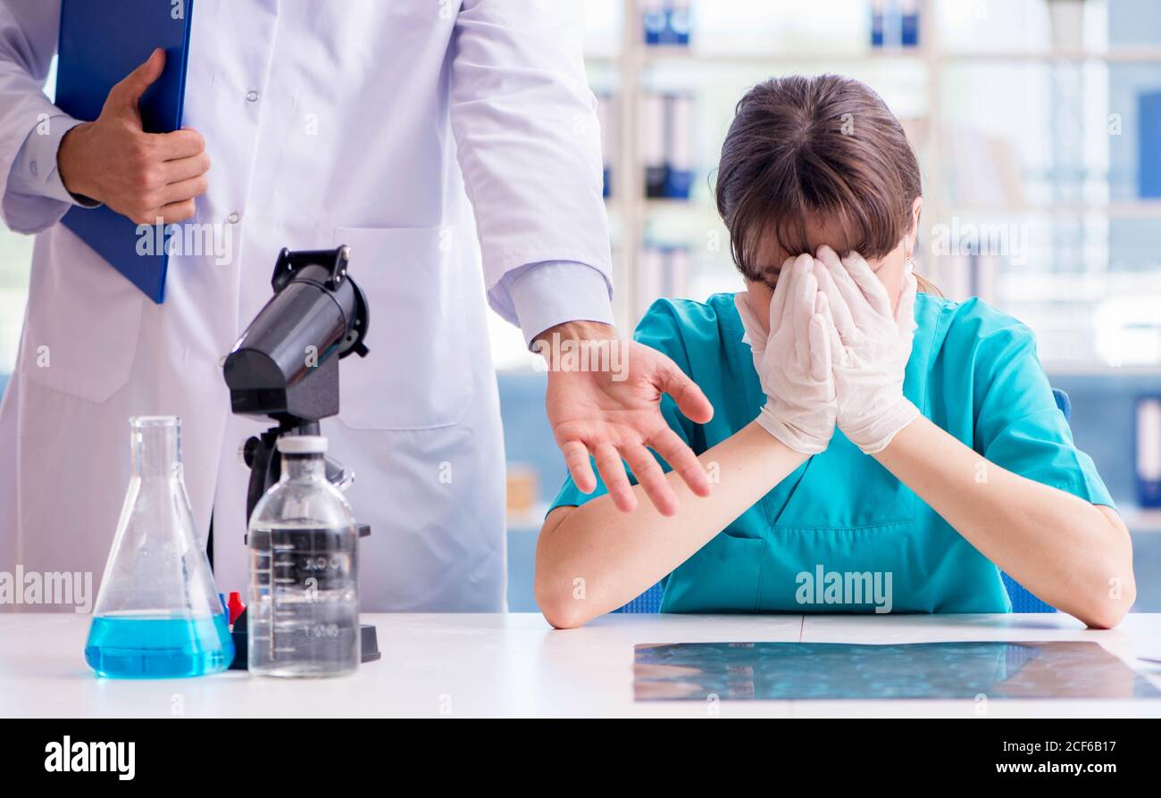 The doctor angry at his assistant due to medical error Stock Photo - Alamy