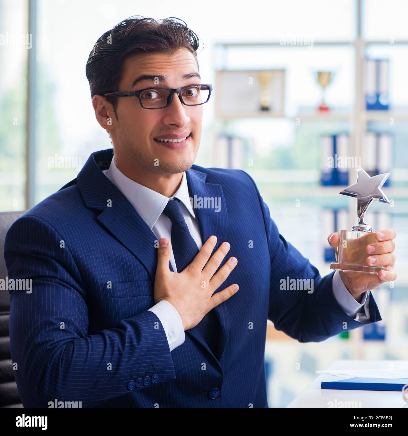 The businessman winning best employee of the month award Stock Photo ...