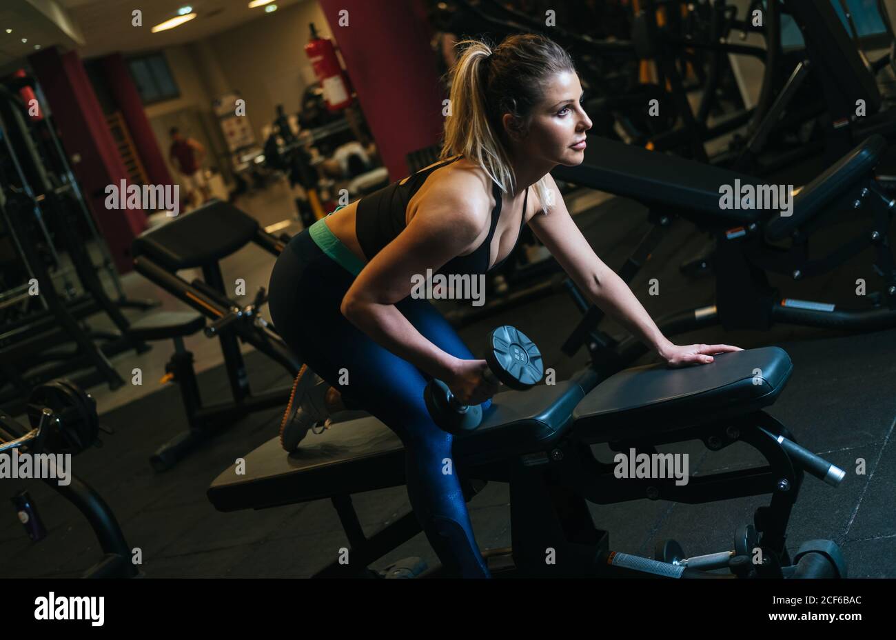 Muscular woman sitting on bench hi-res stock photography and images - Alamy