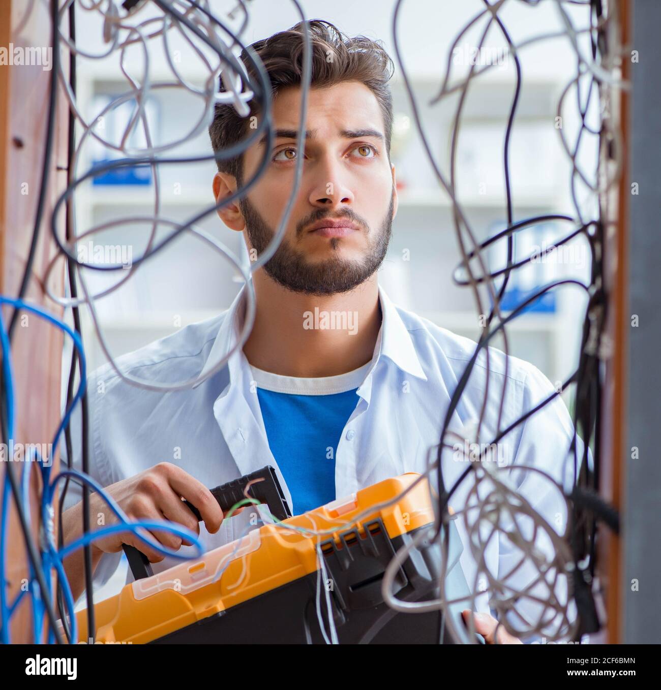 The computer repairman working on repairing network in it workshop ...