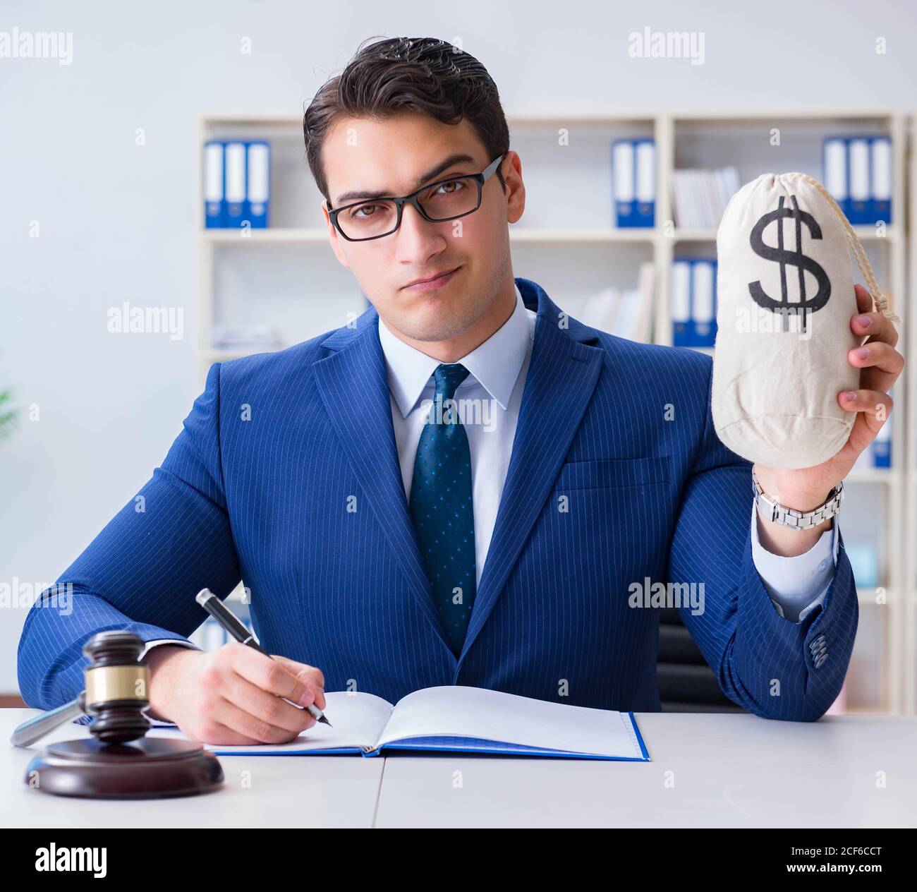 The judge in bribe concept with money Stock Photo - Alamy