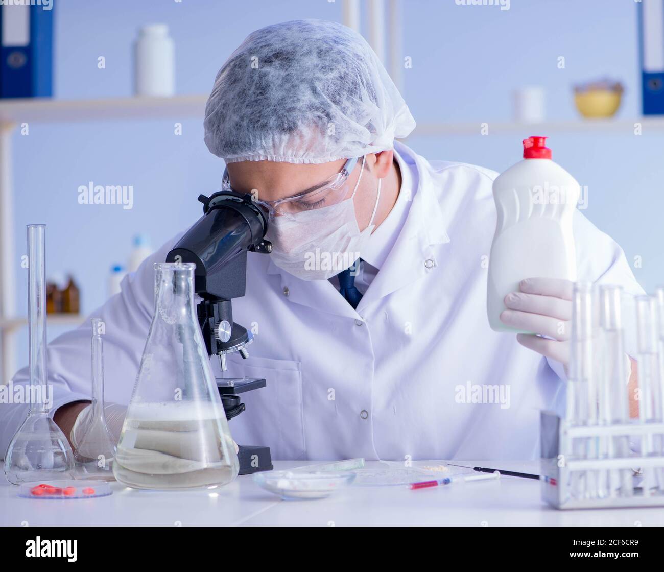 The man in the lab testing new cleaning solution detergent Stock Photo ...