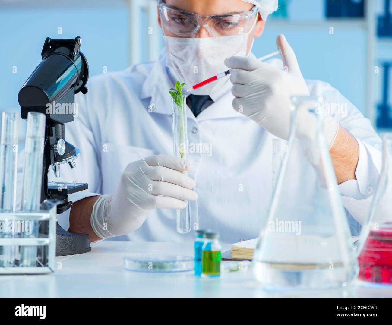 The biotechnology concept with scientist in lab Stock Photo - Alamy