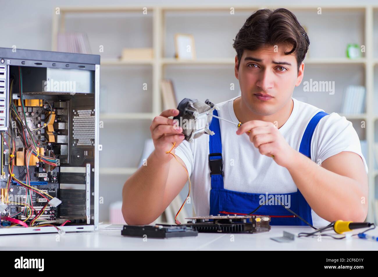 The computer repairman repairing desktop computer Stock Photo - Alamy