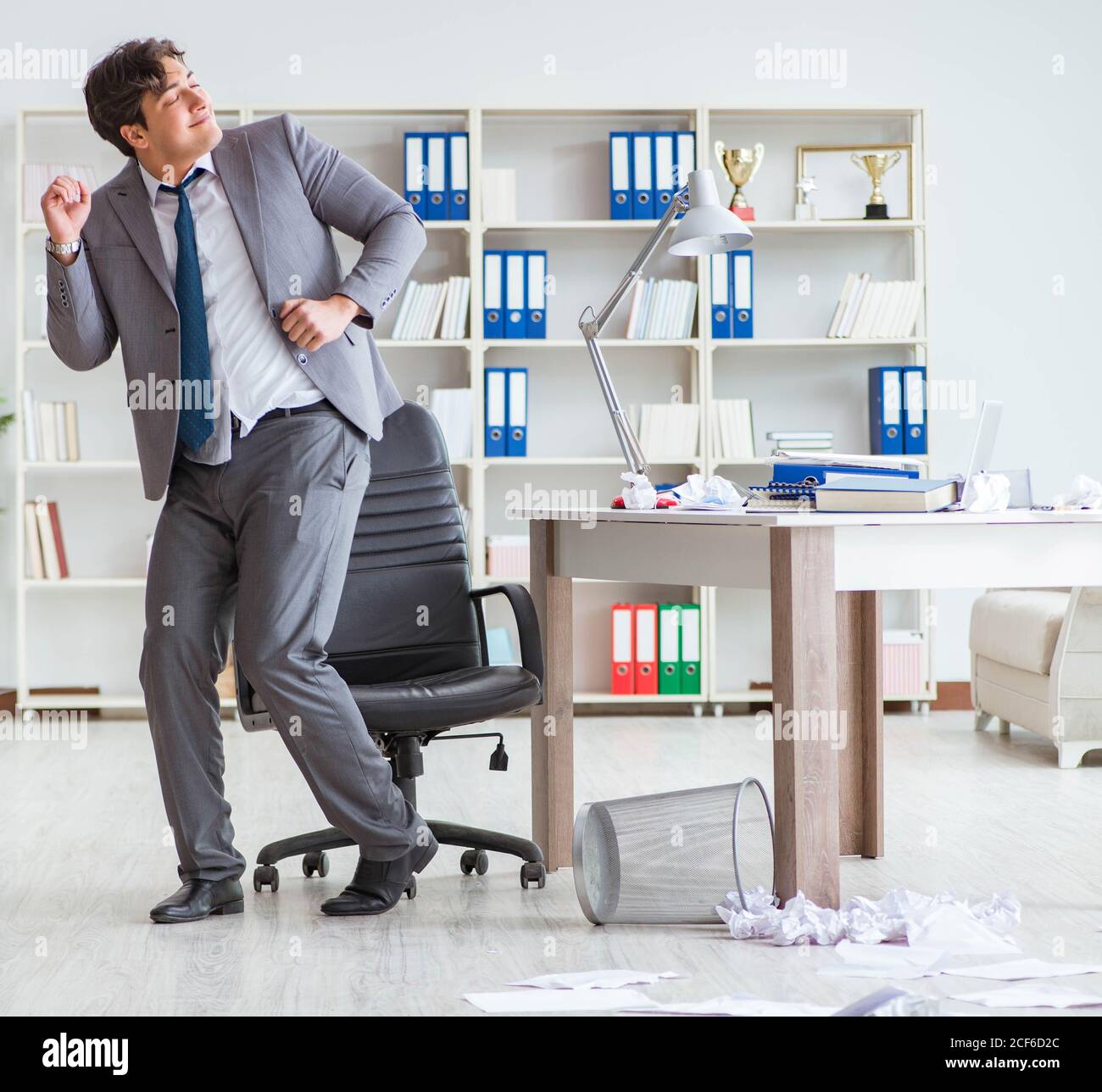 Businessman having fun taking a break in the office at work Stock Photo ...