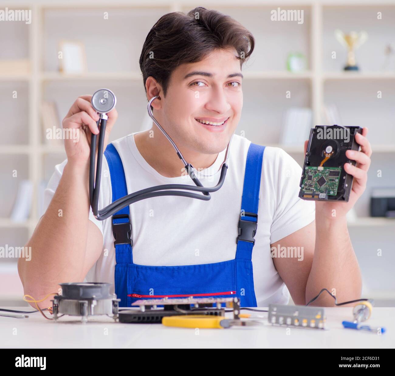 Computer repairman repairing desktop computer Stock Photo - Alamy