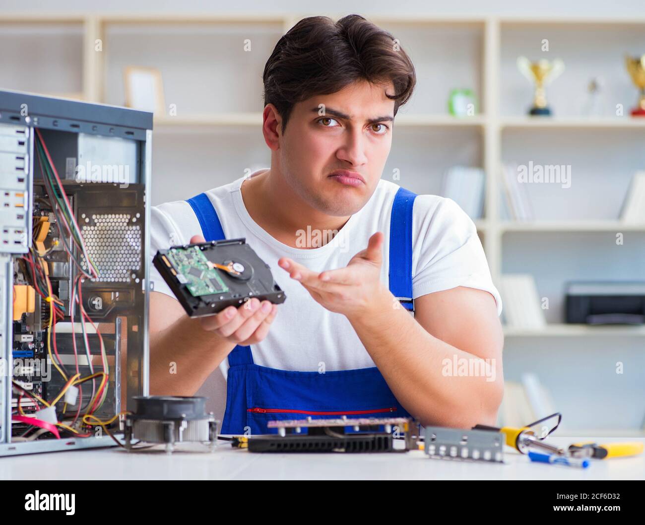 The computer repairman repairing desktop computer Stock Photo - Alamy