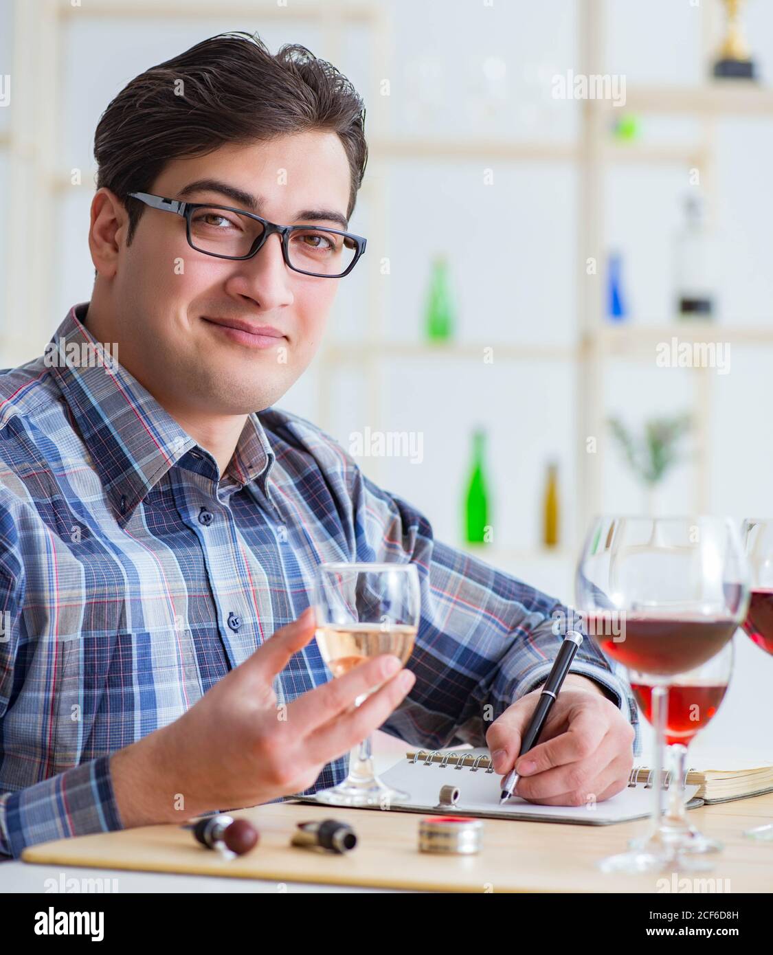 The professional sommelier tasting red wine Stock Photo - Alamy