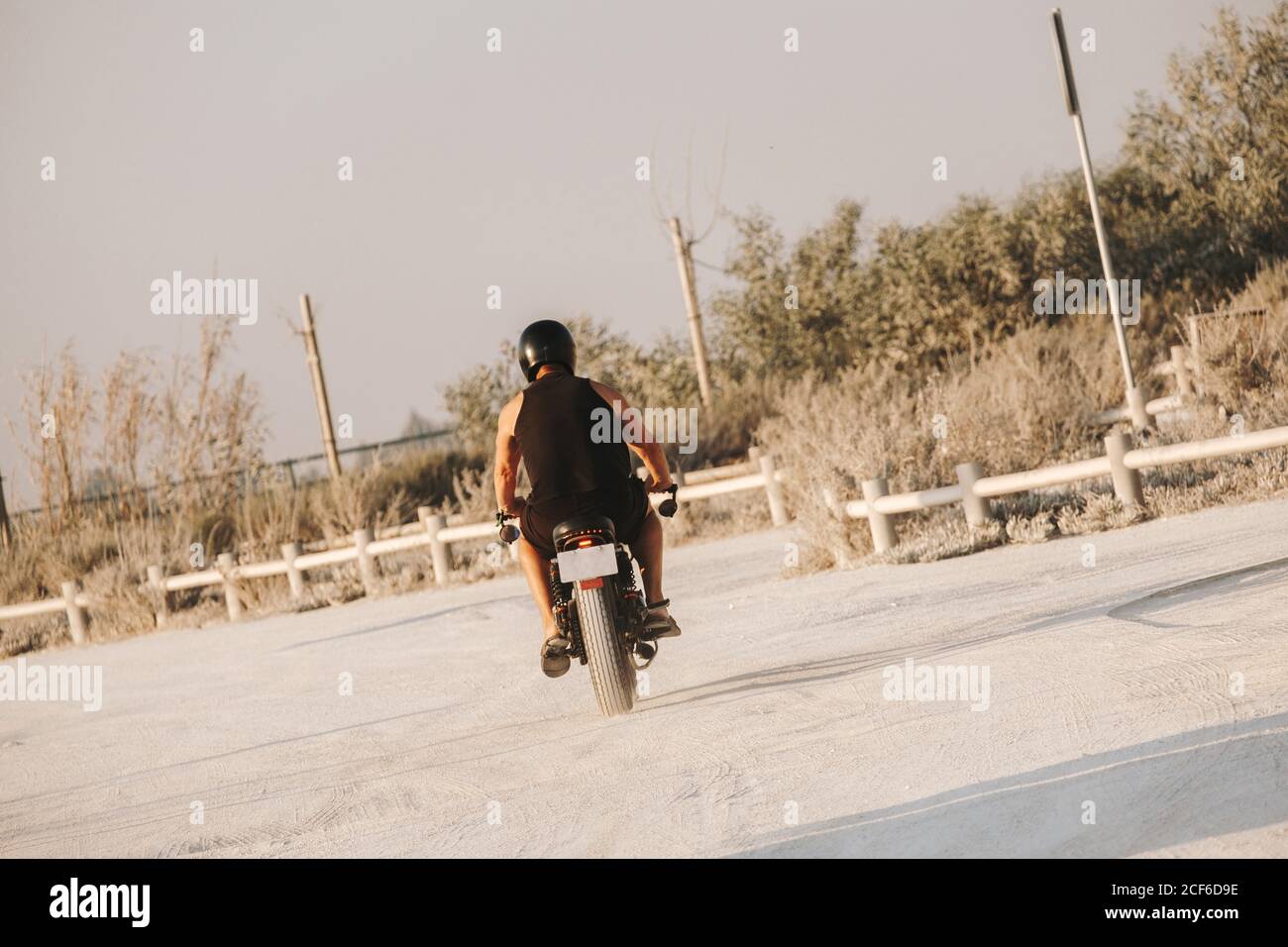 Strong man driving motorcycle Stock Photo - Alamy