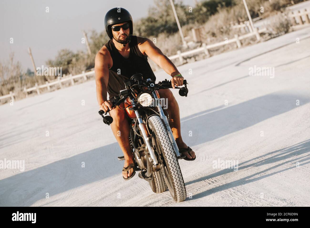 Confident male driving motorcycle Stock Photo - Alamy