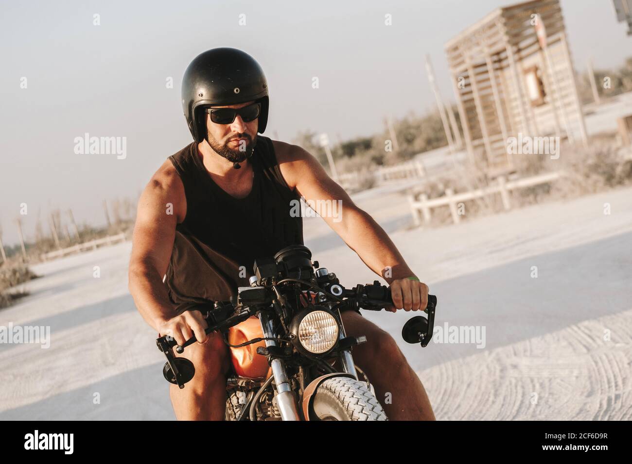 Strong man driving motorcycle Stock Photo - Alamy