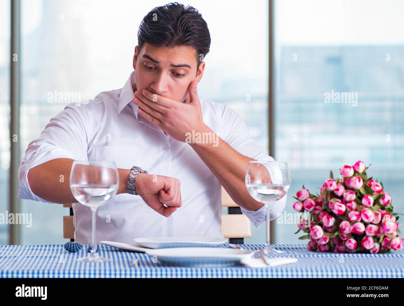 The handsome man alone in restaraunt on date Stock Photo - Alamy