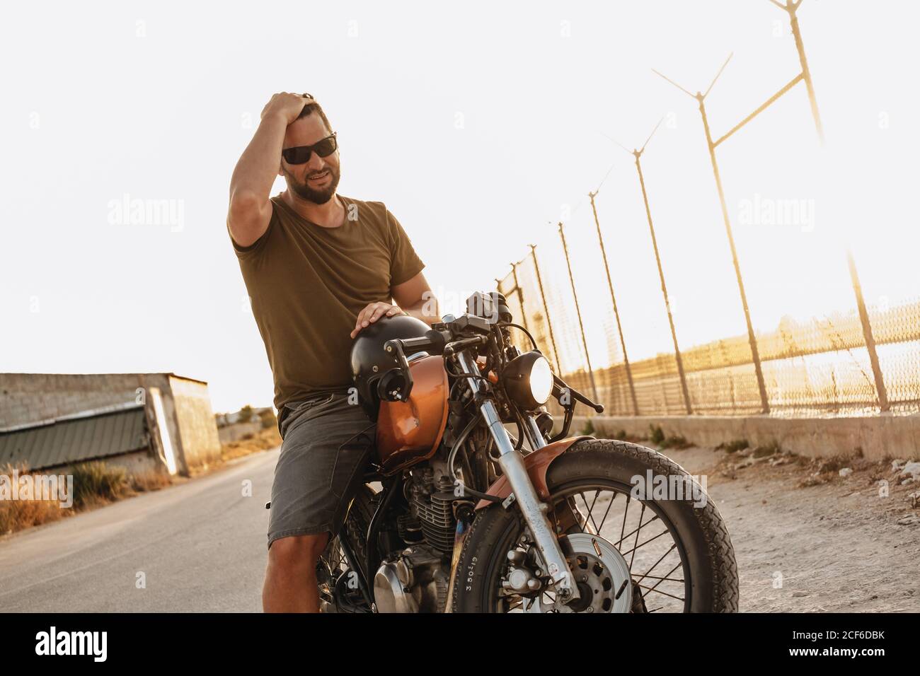 Strong man driving motorcycle Stock Photo - Alamy