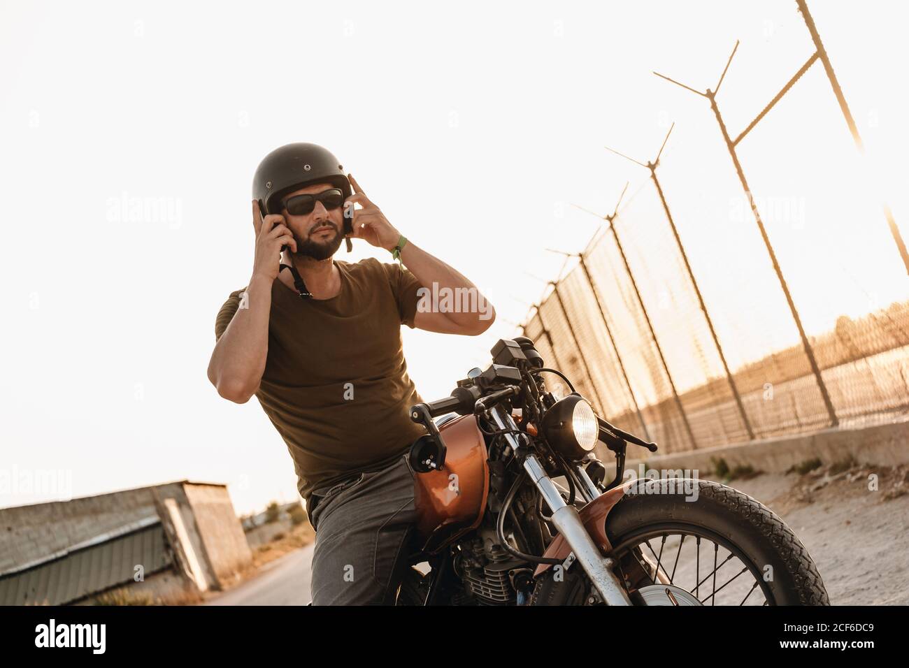 Strong man driving motorcycle Stock Photo - Alamy
