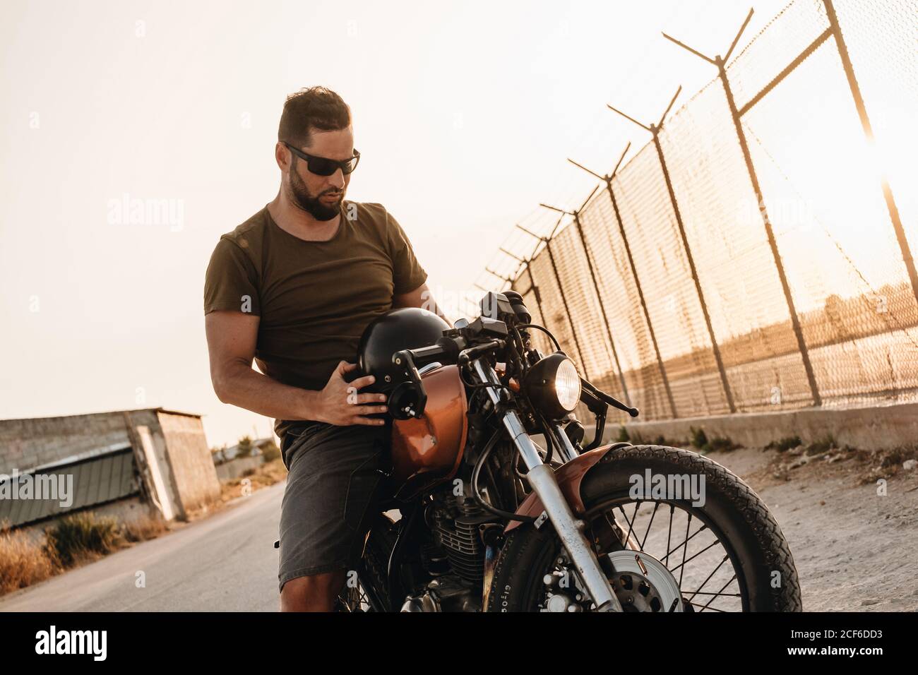 Strong man driving motorcycle Stock Photo - Alamy