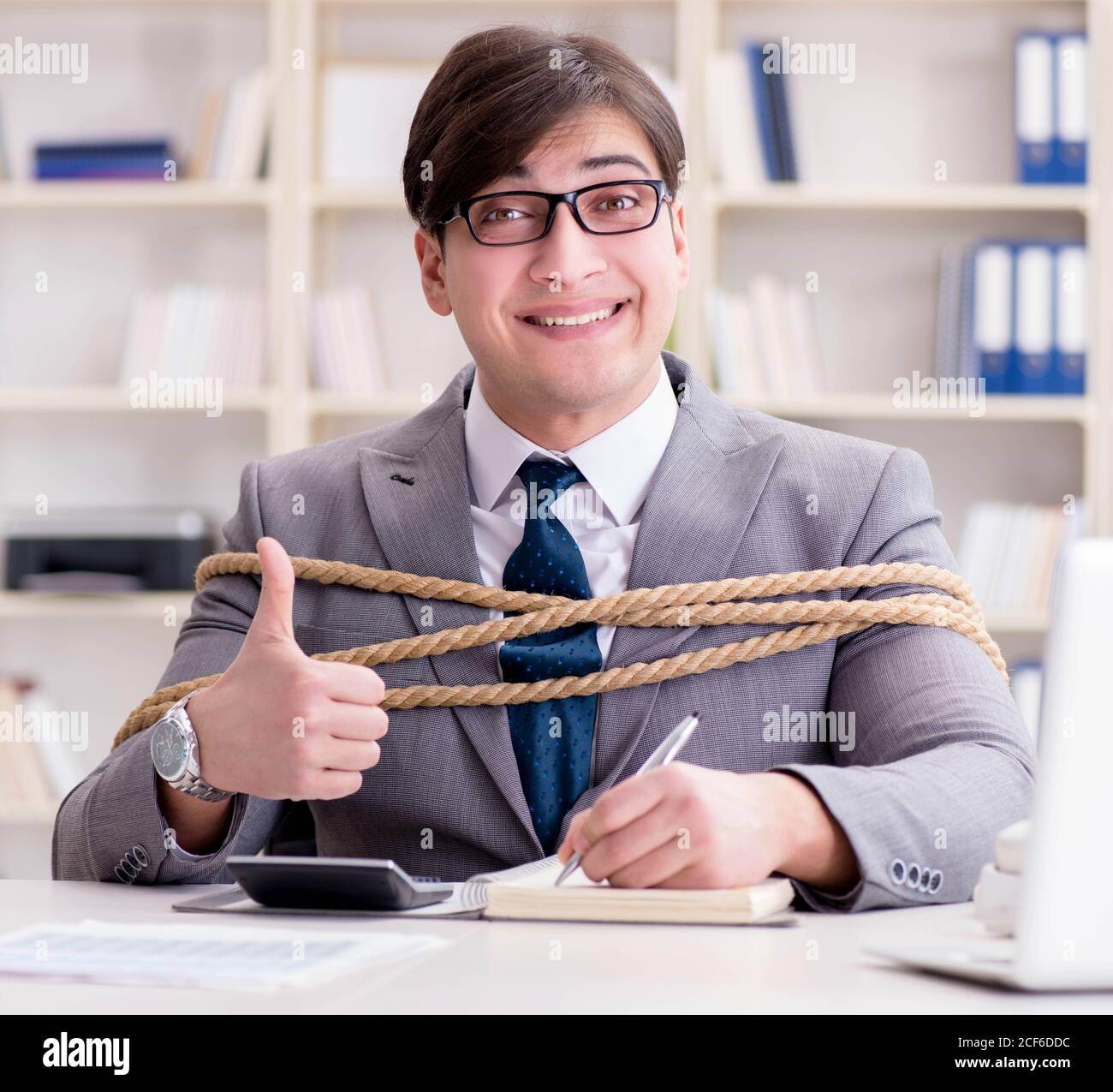 Businessman tied up in rope hi-res stock photography and images - Alamy