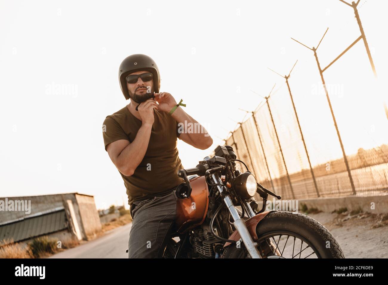 Strong man driving motorcycle Stock Photo - Alamy