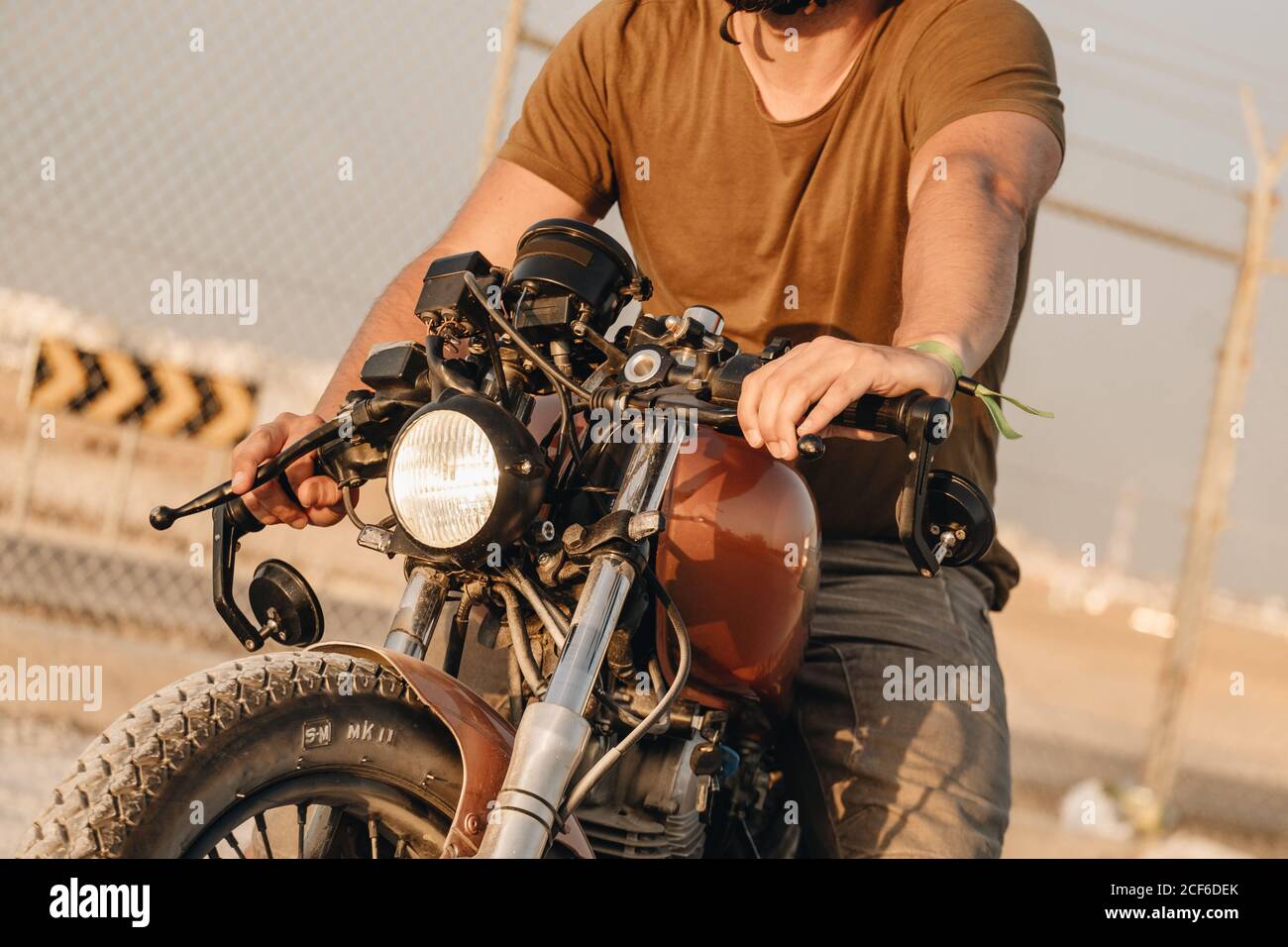Strong man driving motorcycle Stock Photo - Alamy