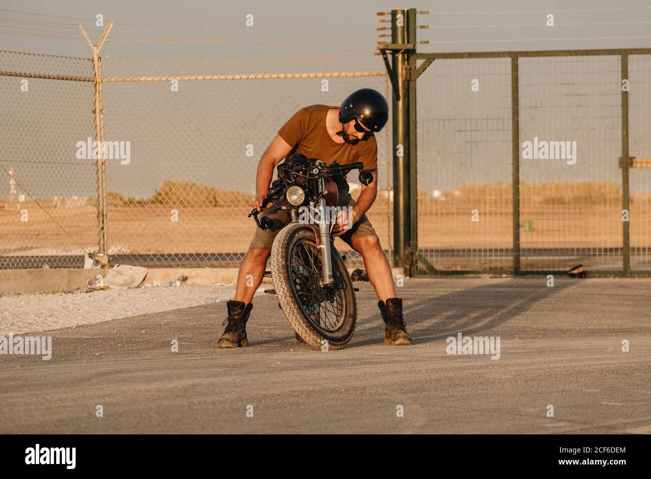 Fixing motorcycle hi-res stock photography and images - Alamy