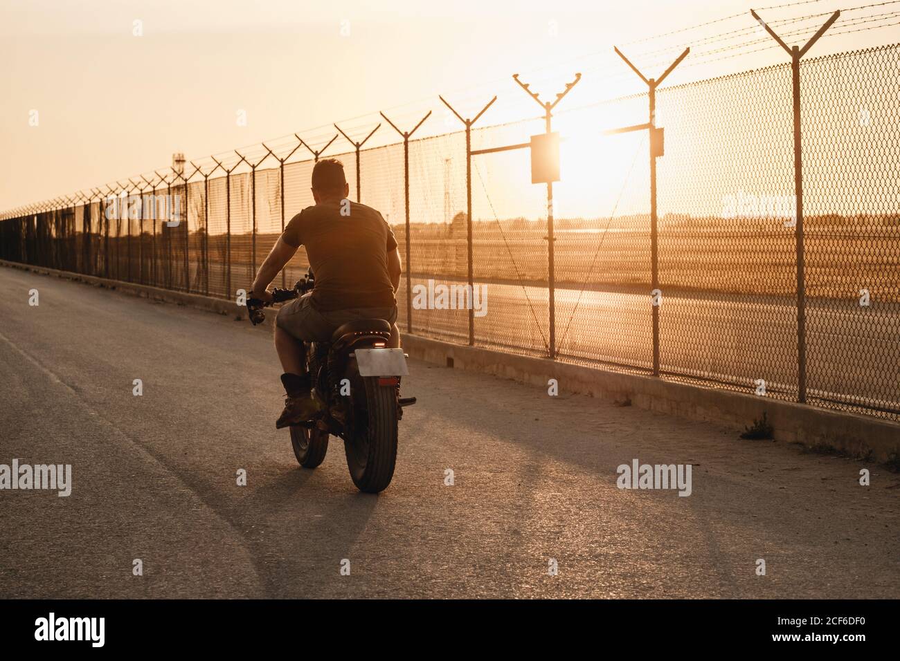 Strong man driving motorcycle Stock Photo - Alamy