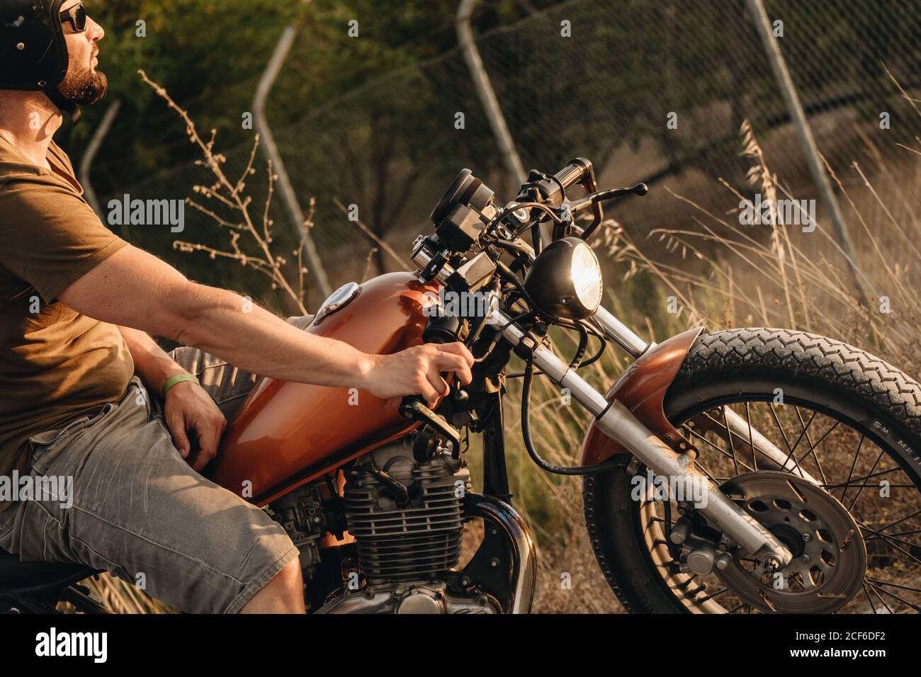 Strong man driving motorcycle Stock Photo - Alamy
