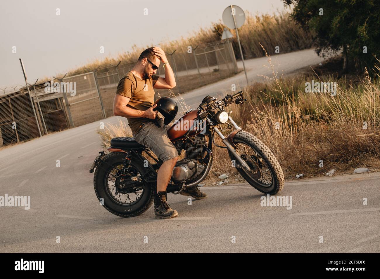 Strong man driving motorcycle Stock Photo - Alamy