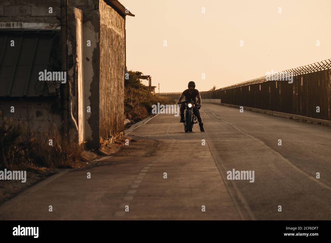 Strong man driving motorcycle Stock Photo - Alamy