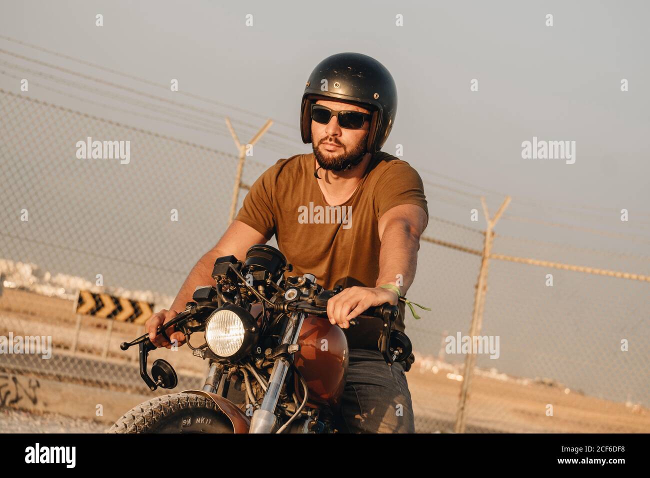 Strong man driving motorcycle Stock Photo - Alamy