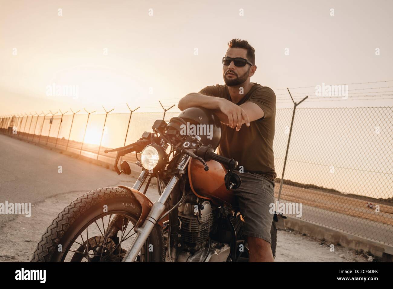 Strong man driving motorcycle Stock Photo - Alamy