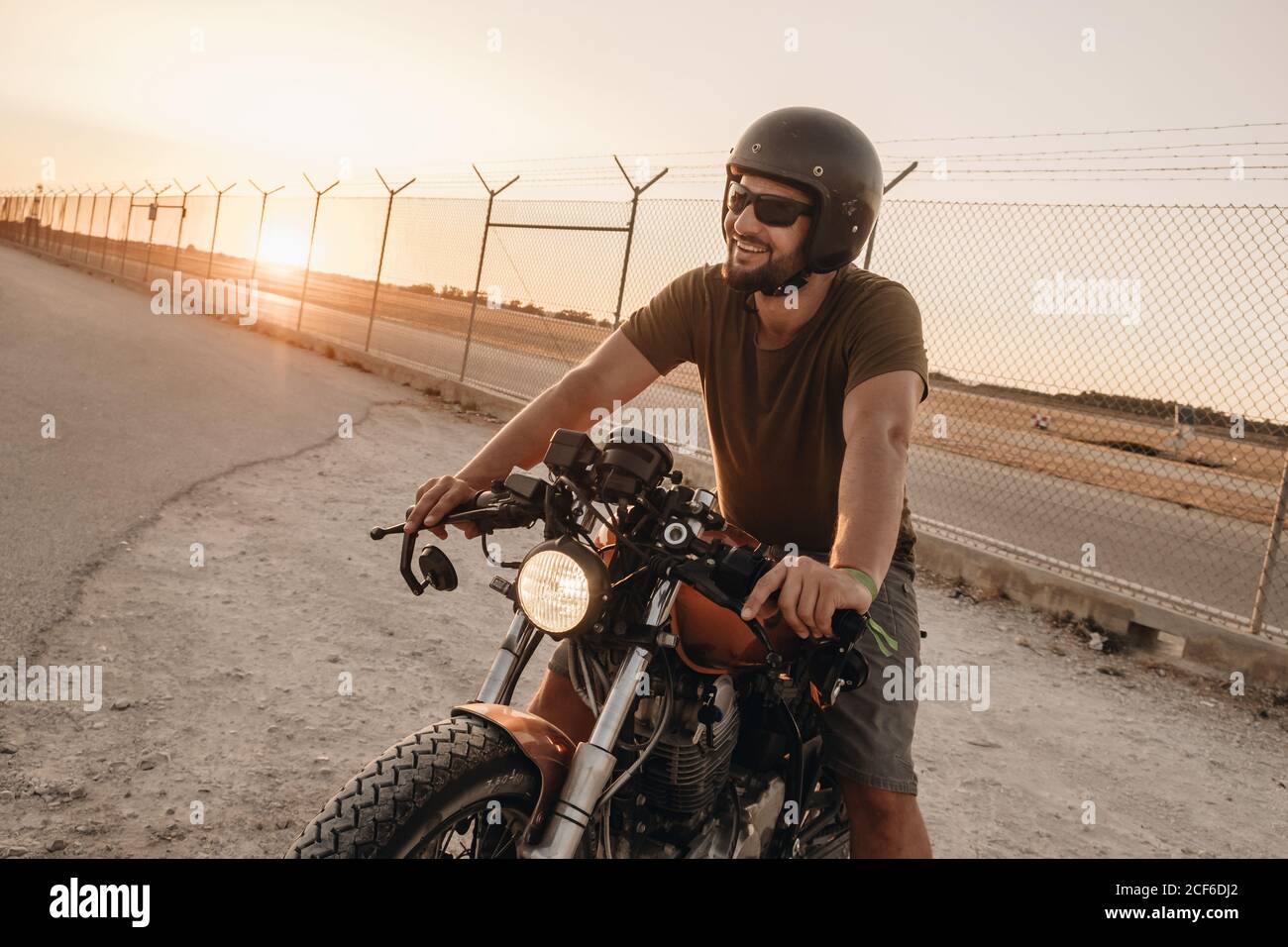 Strong man driving motorcycle Stock Photo - Alamy