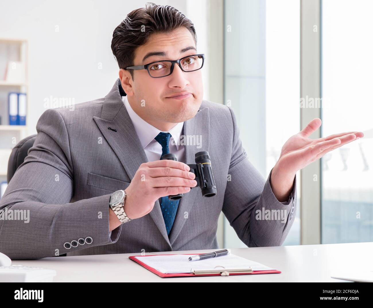 The man looking for errors and mistakes in report Stock Photo - Alamy