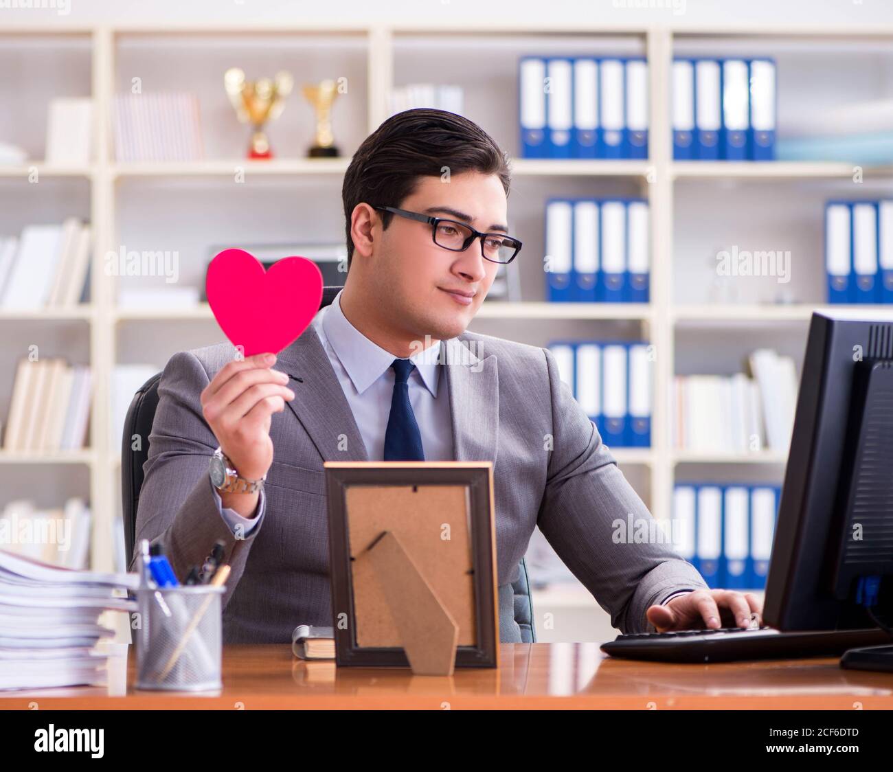 The businessman feeling love and loved in the office Stock Photo - Alamy