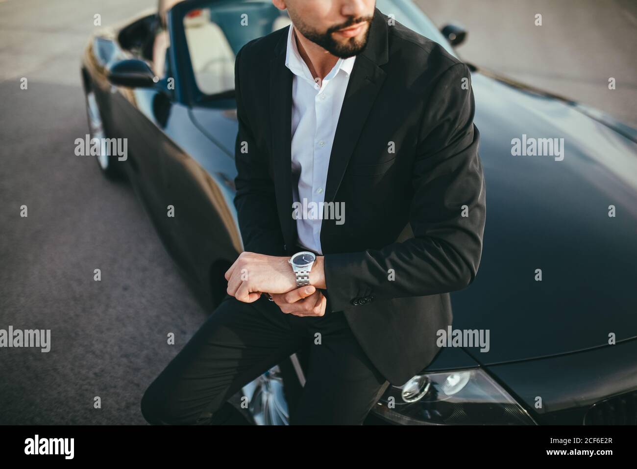 Crop attractive businessman with convertible car Stock Photo - Alamy