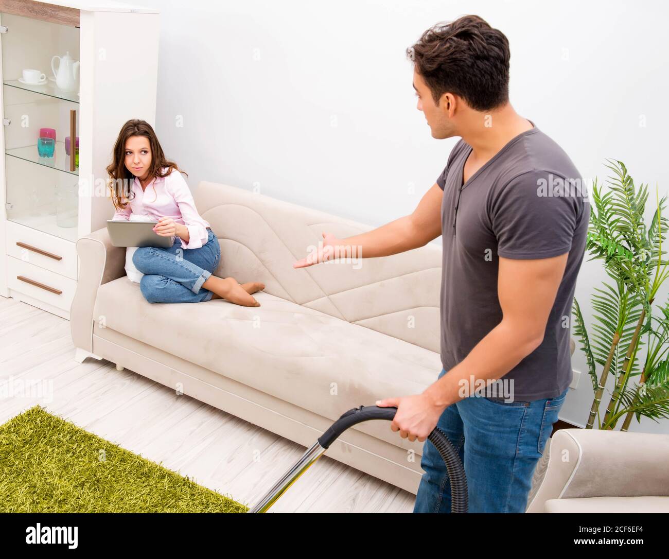 Cleaning the house with vacuum cleaner Stock Photo - Alamy
