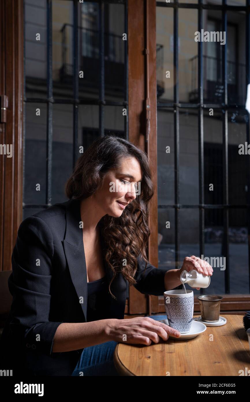 Beautiful young woman drinking latte hi-res stock photography and ...