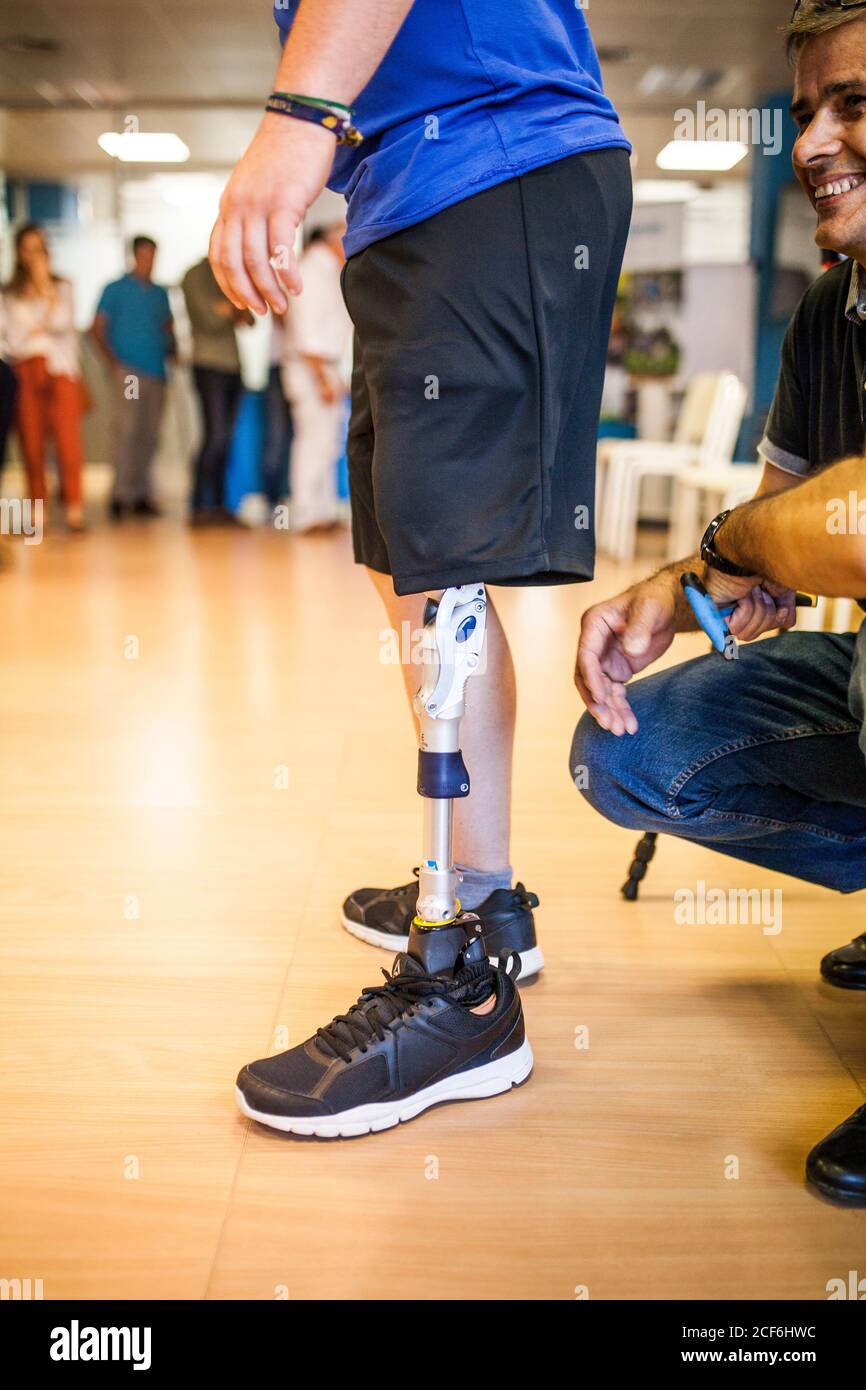 Prosthetic engineer reviewing the prosthesis of a patient and improving ...