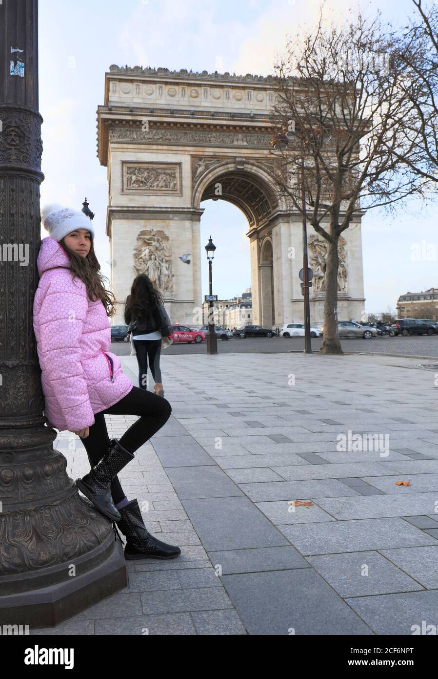 girl standing against triumphal arch Stock Photo - Alamy