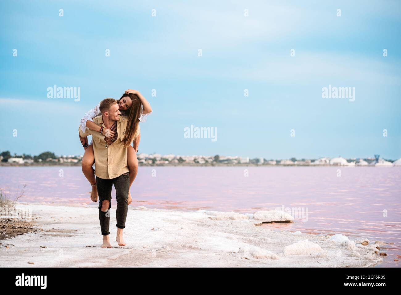 Piggyback ride beach hi-res stock photography and images - Alamy