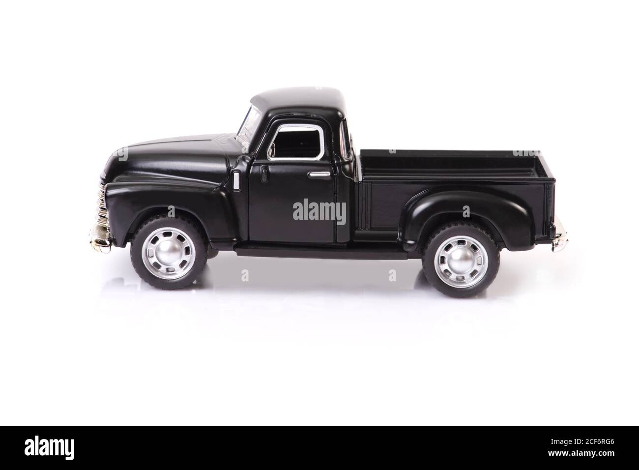 Side view of black old style model pickup truck on white background ...