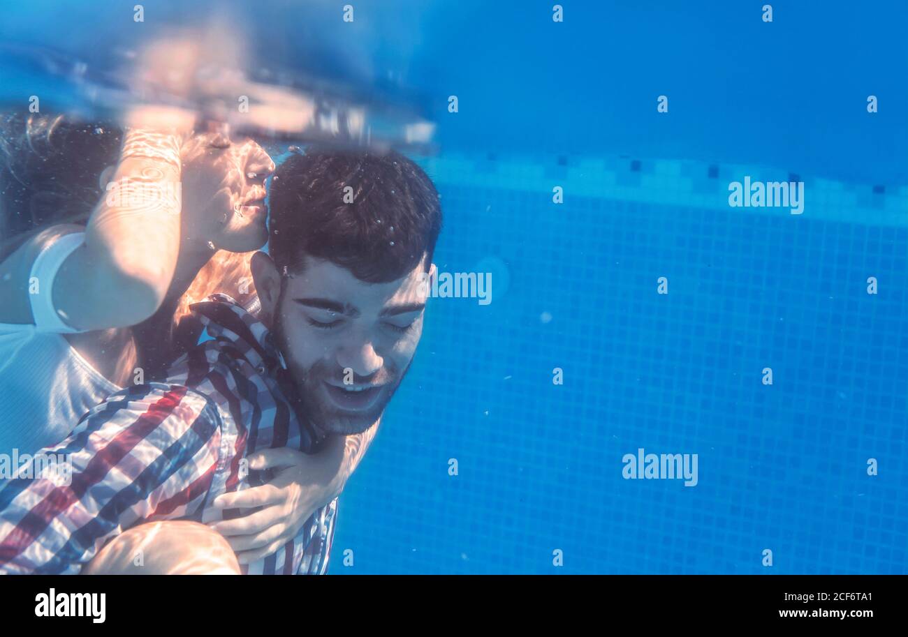 Woman diving into pool and underwater hi-res stock photography and ...