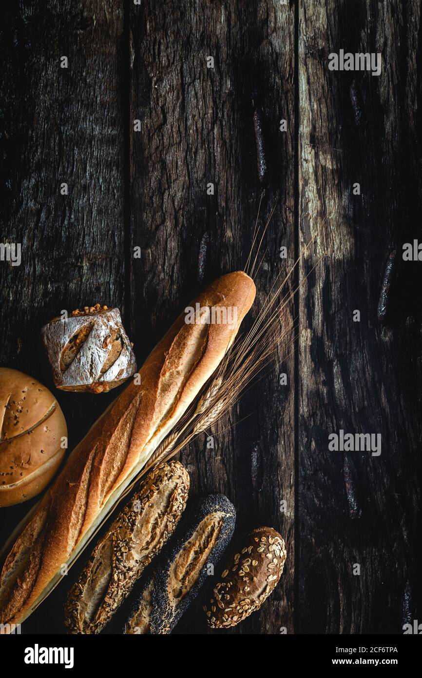 Gold assortment bread homemade on dark wood background, captured from ...