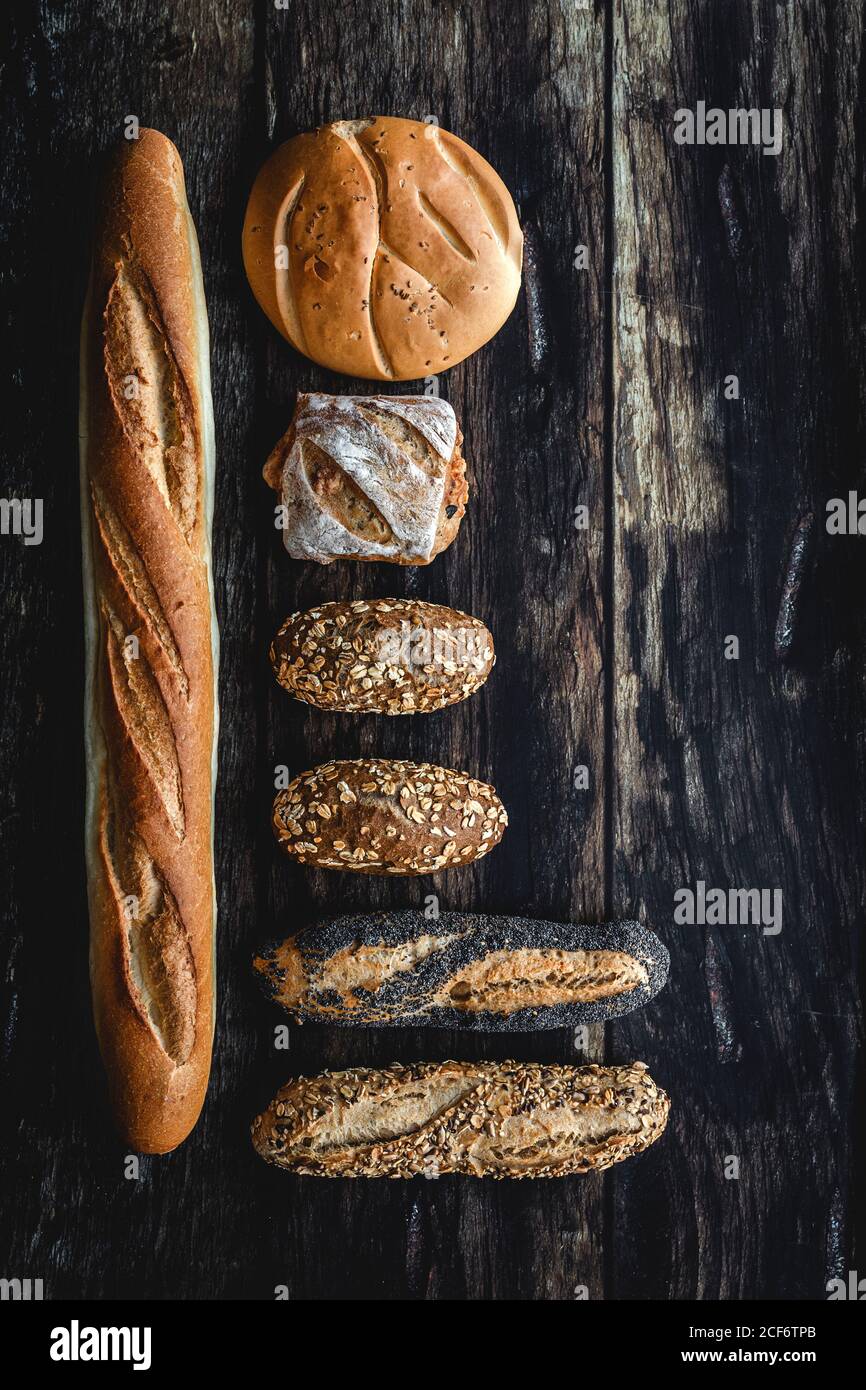 Gold assortment bread homemade on dark wood background, captured from ...