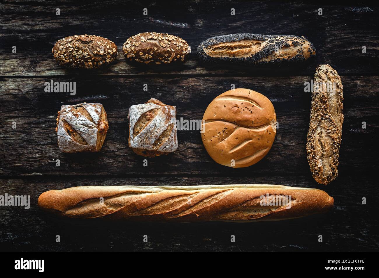 Gold assortment bread homemade on dark wood background, captured from ...