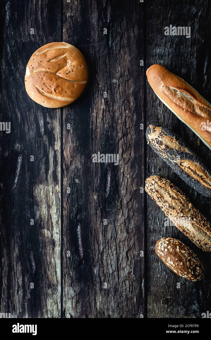 Gold assortment bread homemade on dark wood background, captured from ...
