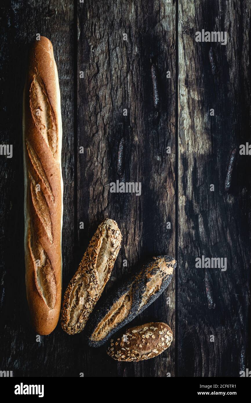 Gold assortment bread homemade on dark wood background, captured from ...