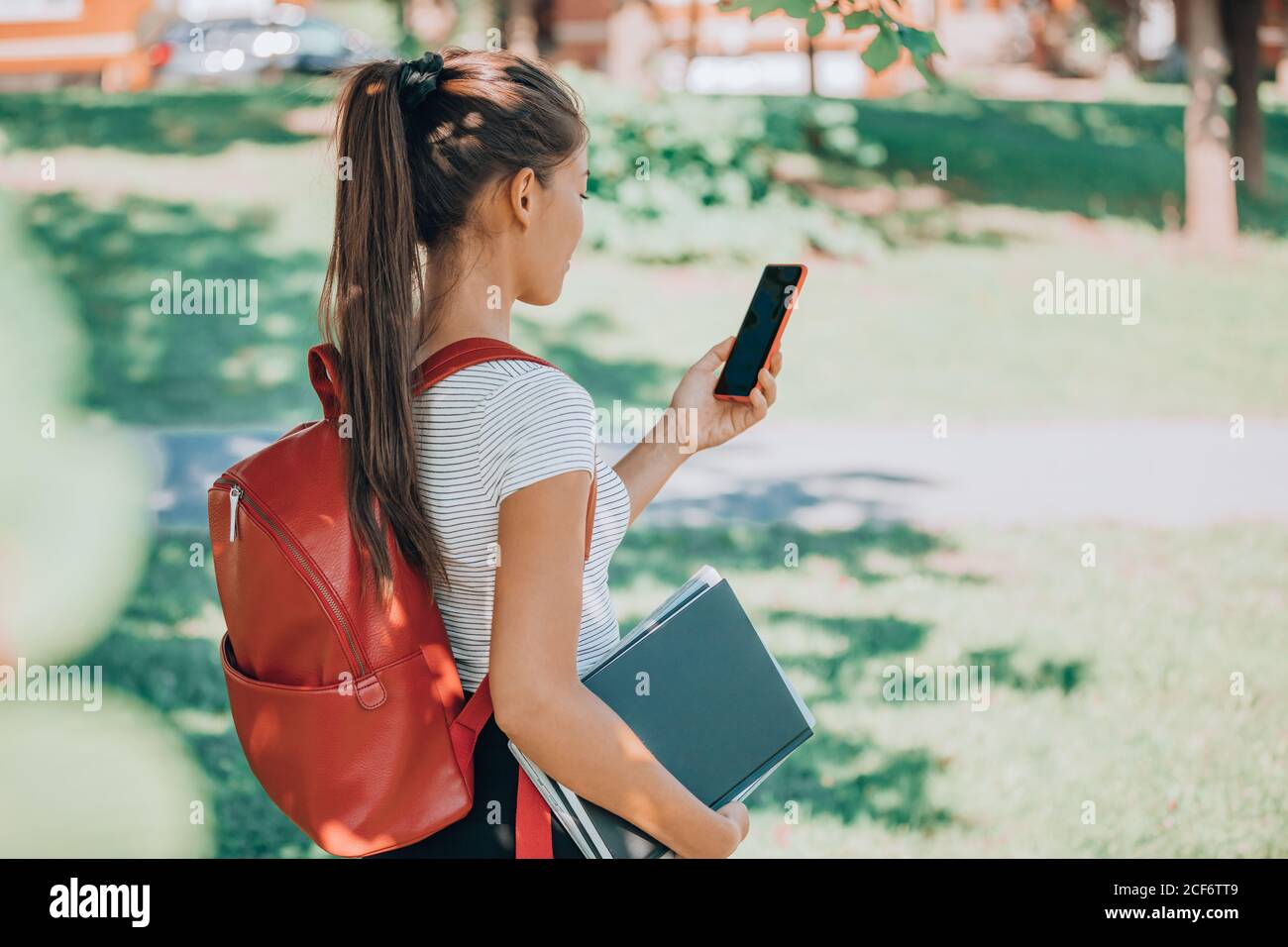 Back to school semester online on phone app. University student using ...