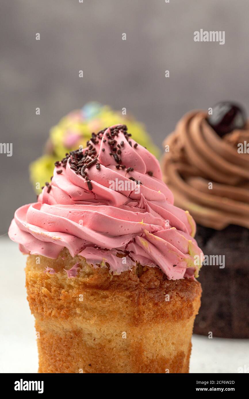 Delicious homemade cupcakes on rustic background Stock Photo - Alamy
