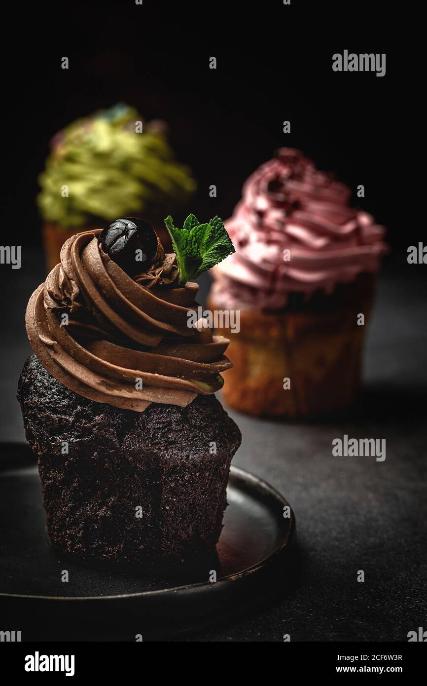 Delicious homemade cupcakes on rustic background Stock Photo - Alamy