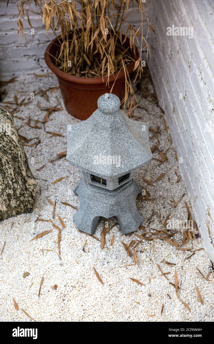 White wall, reed, stone incense burner Stock Photo - Alamy